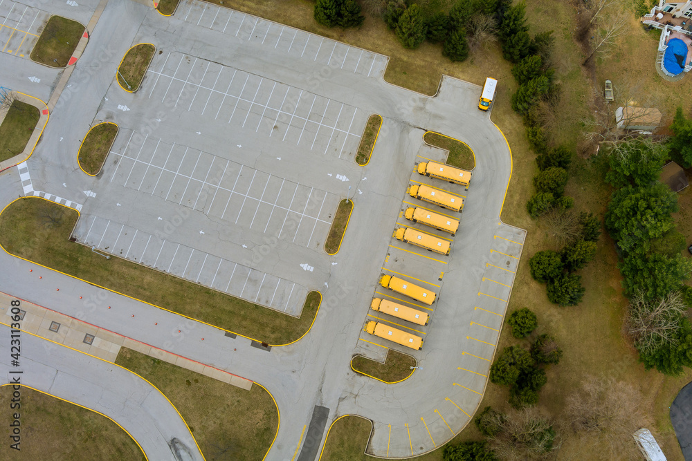 School buses in the school parking lot Stock Photo | Adobe Stock