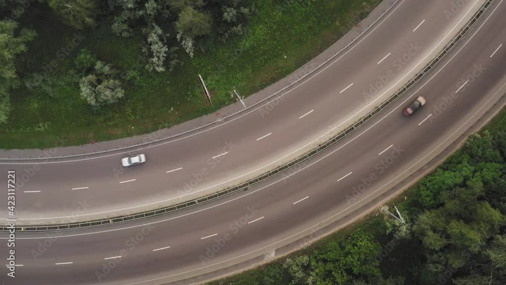 Smooth traffic at the turn of the two-lane highway - Traffic of cars on ...