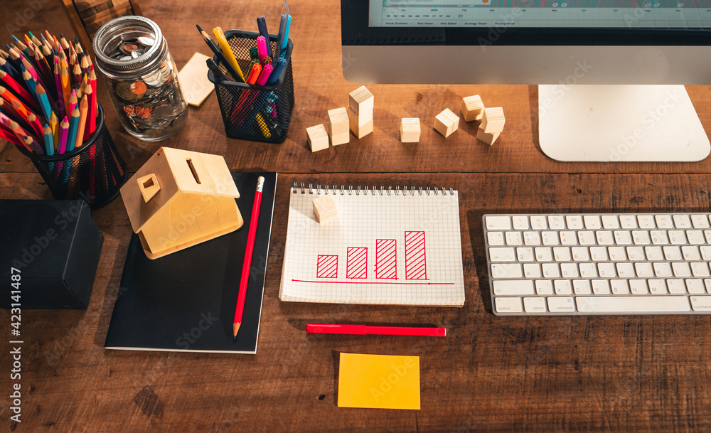 Drawing a graph of growth in a notebook on your desk at home. Stock ...
