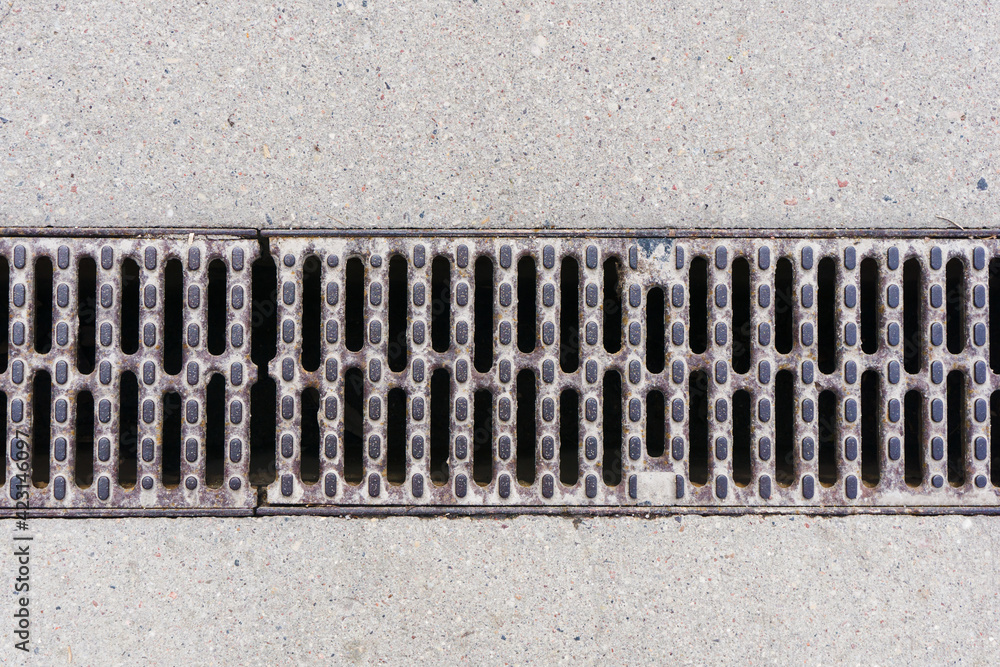 Manhole on concrete drain system cover. Urban sewer background. Metal ...