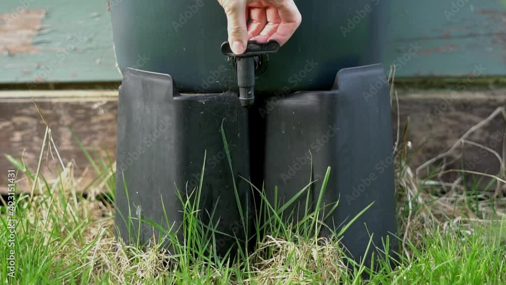 Outside water tap in front on view running water in slow motion. Water ...
