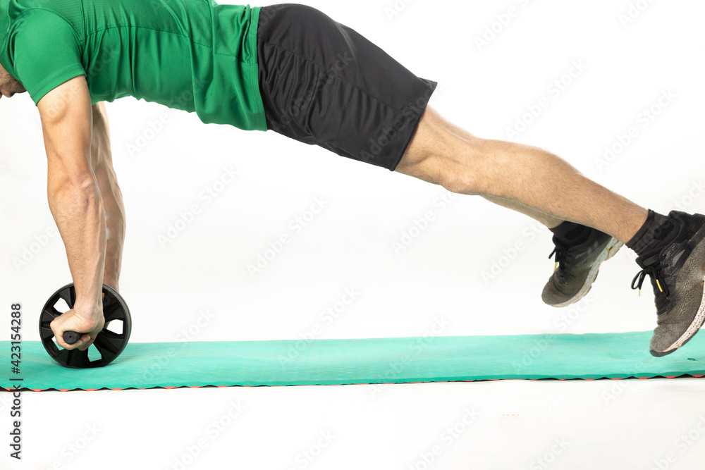 man with Ab roll Bodytone for abdominal strengthening. Small wheel that ...