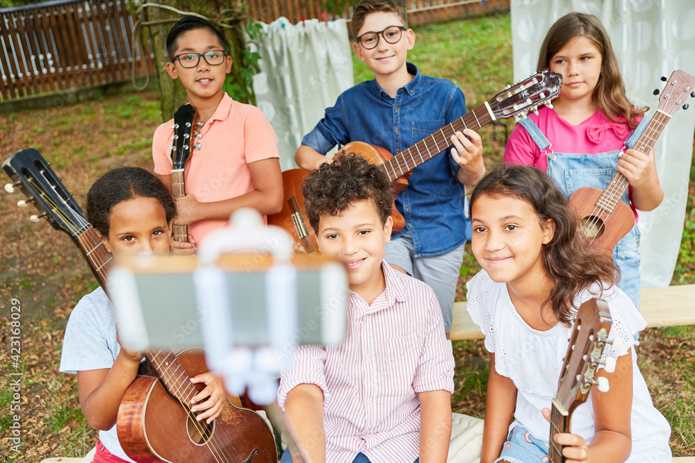 Group of children as a band at the talent show Stock Photo | Adobe Stock