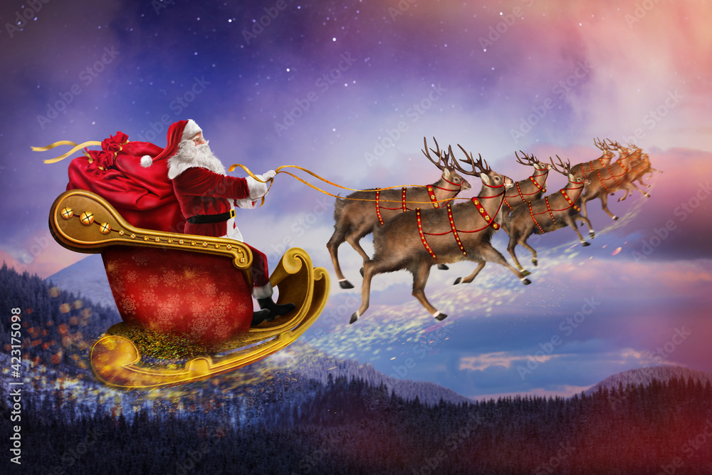 Magic Christmas eve. Santa with reindeers flying in sky Stock Photo ...