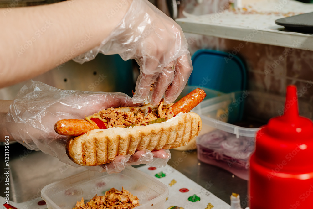 Danish hot dog. the process of preparing a Danish hot dog in the ...