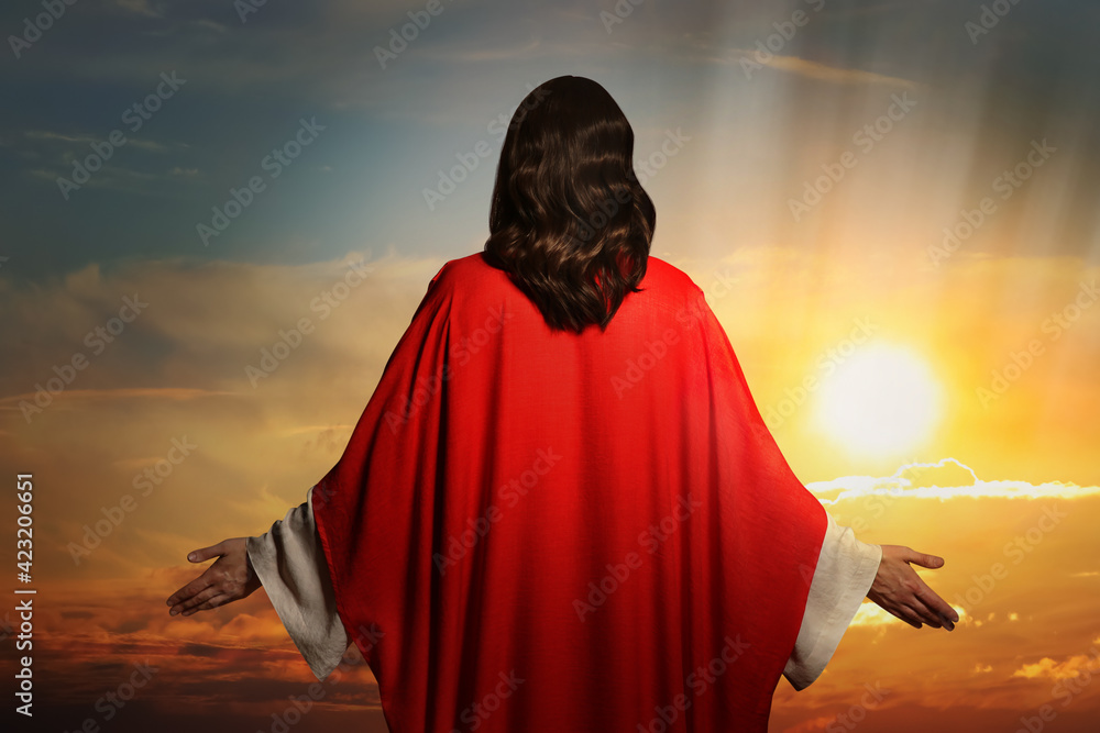 Jesus Christ outdoors at sunset, back view Stock Photo | Adobe Stock