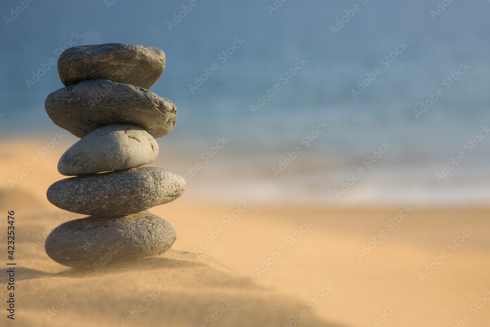 Pebble stack during a sandstorm in the dunes. Maspalomas, Gran Canaria ...