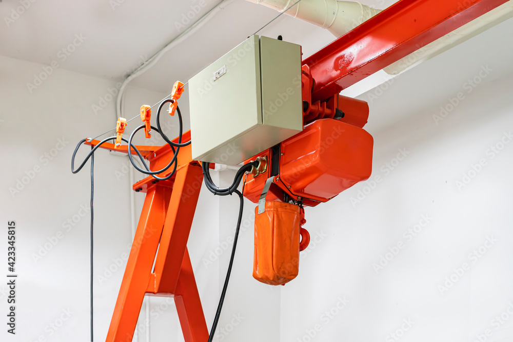 Overhead electric chain hoist and power control box with drive wheel ...