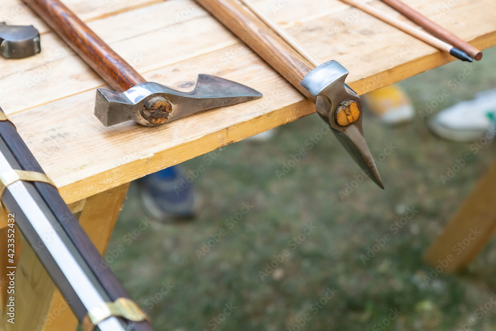 set of weapons battle ax with a long handle and a musket stacked on a ...