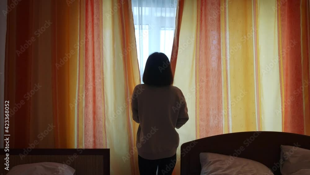 hope concept. Window curtains girl a silhouette on light background ...