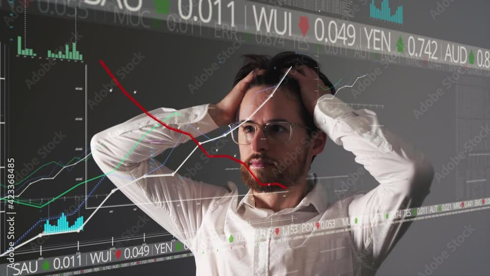 Stressed young business man pulling his hair up while looking ...