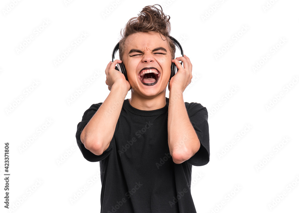 Teen boy in headphones with spooking make-up making Rock Gesture ...