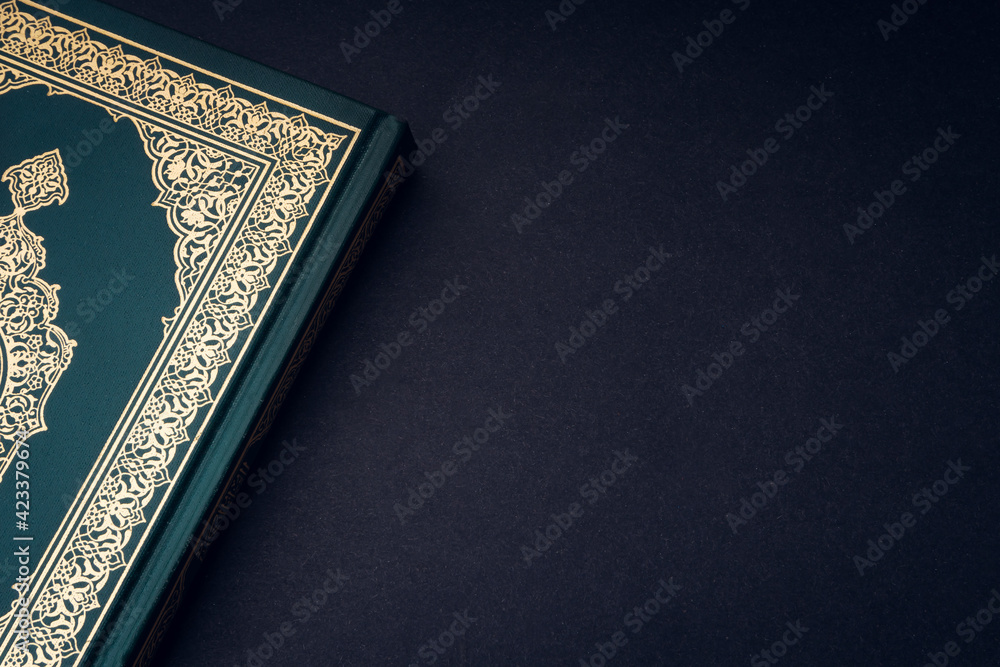 Holy Al Quran with written arabic calligraphy meaning of Al Quran on ...