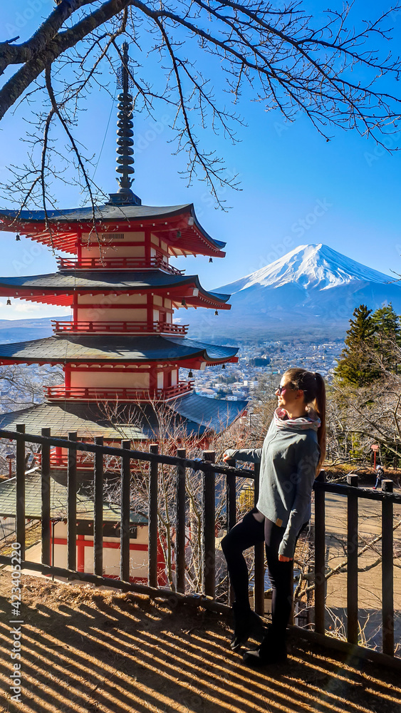 Girl admiring Chureito Pagoda and view on Mt Fuji, Japan, captured on a ...
