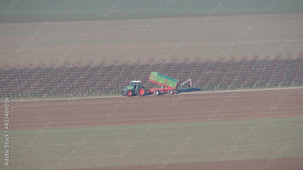 Landwirt auf dem Feld mit dem Trecker Stock Photo | Adobe Stock