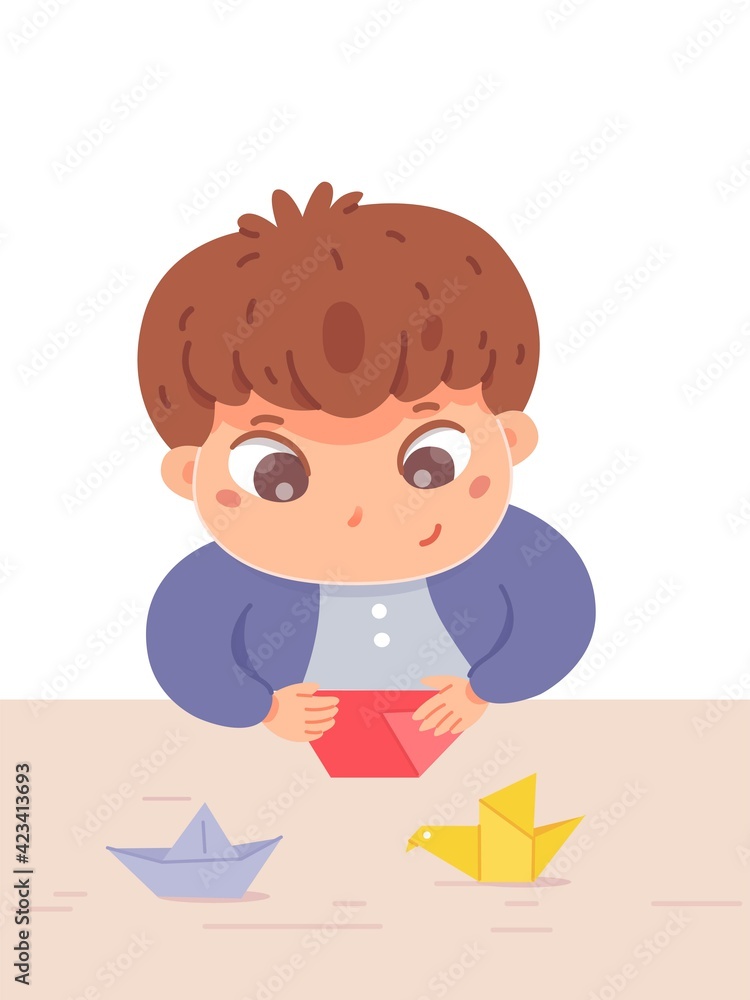 Boy making origami in art and crafts class. Little child folding paper ...