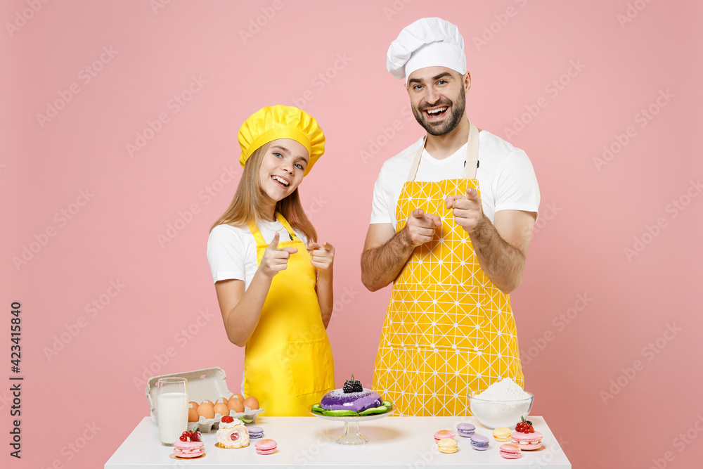 Teen happy fun girl dad chef cook confectioner baker in yellow apron ...