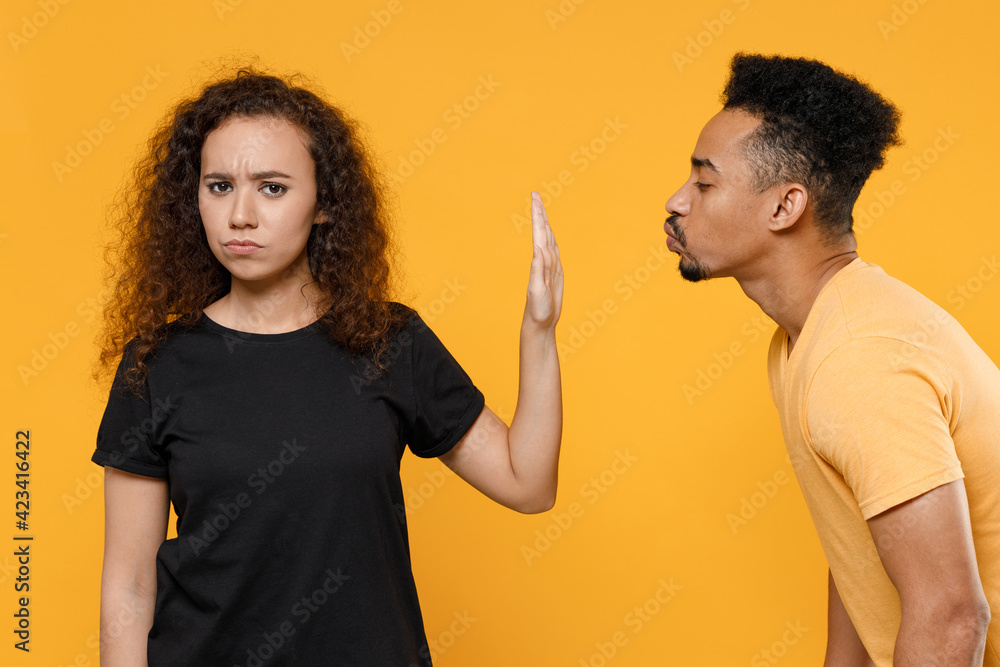 Young happy couple together african strict serious woman man in black t ...
