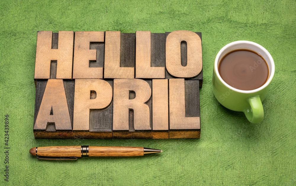 Hello April word abstract in vintage letterpress wood type with a cup ...