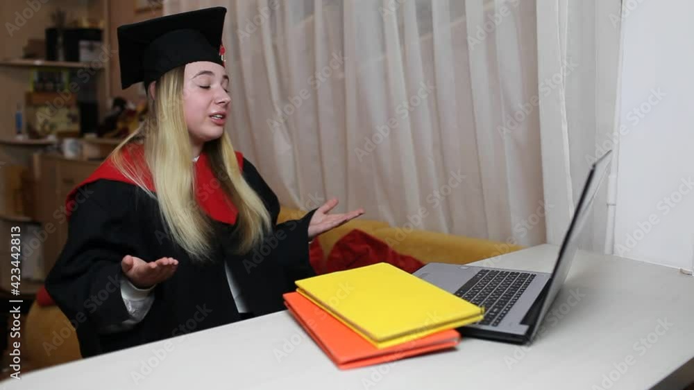 Virtual graduation and convocation ceremony. Excited student wearing ...