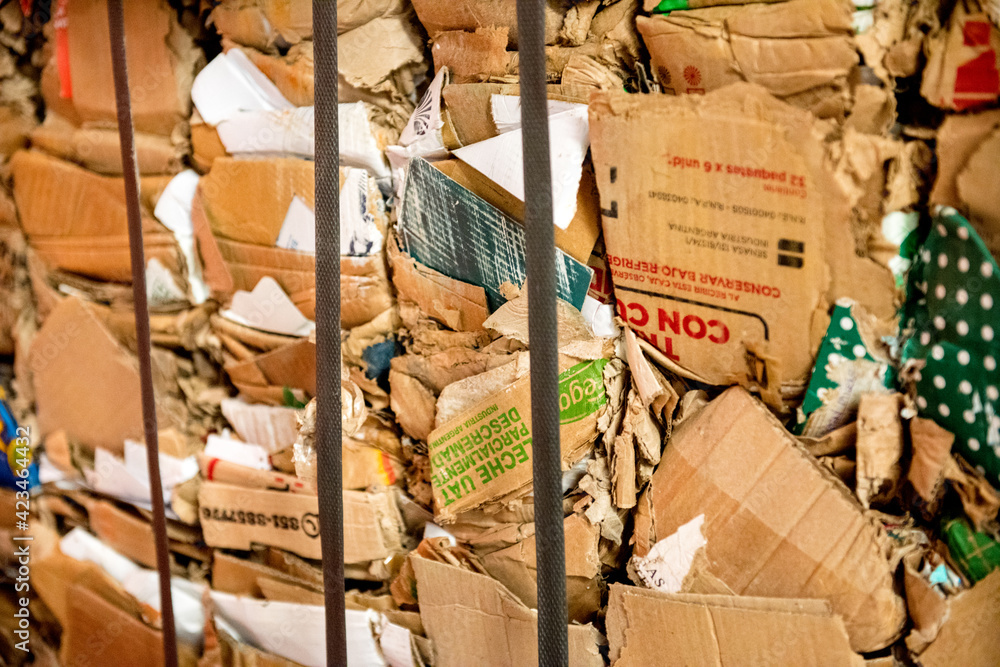 Recycle cardboard packaging concept with stacks of compressed ...