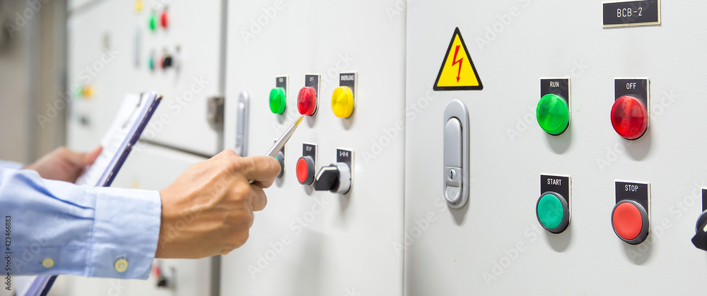 Electrical engineer checking electricity of air handling unit (AHU ...