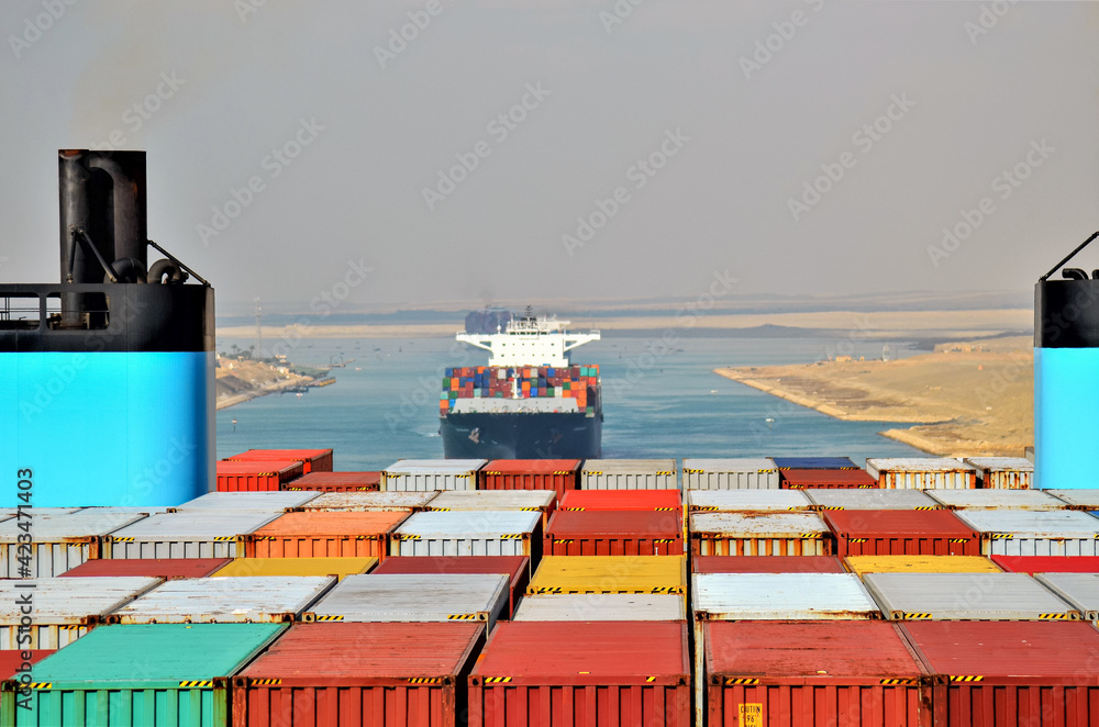 Container ship transiting through Suez Canal. View on the funnels ...
