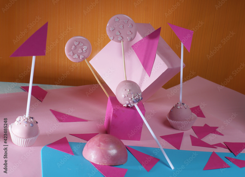 geometric shapes cubes in a triangle in a still life with cake pops ...