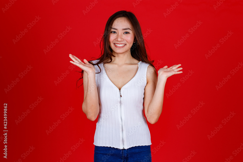 Portrait of charming and cute young Asian girl pose with wildly smile ...