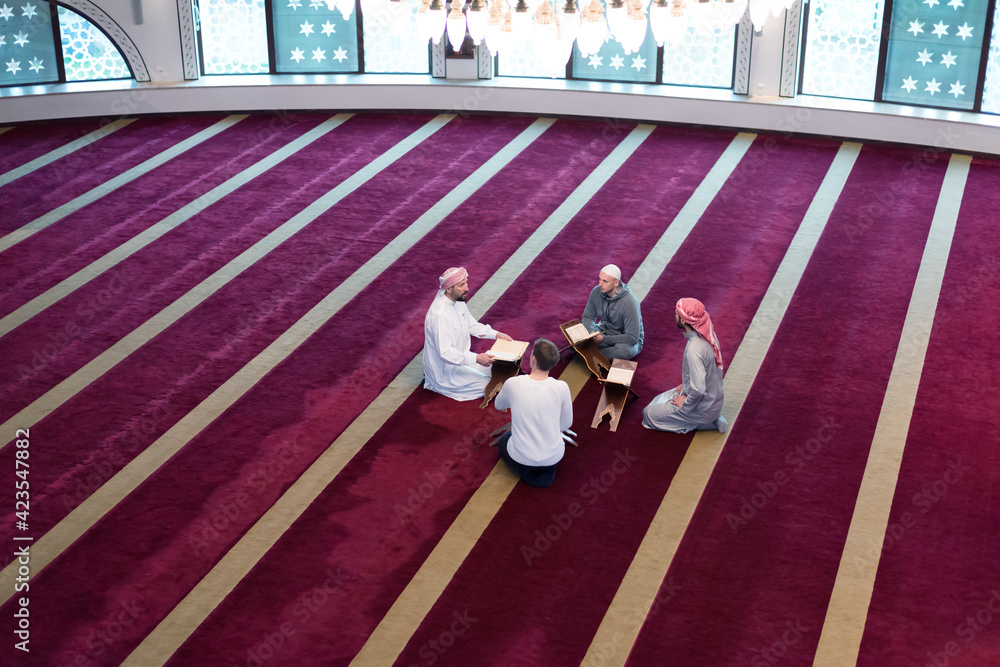 Group of Muslims reading, reciting and remembering Quran during the ...