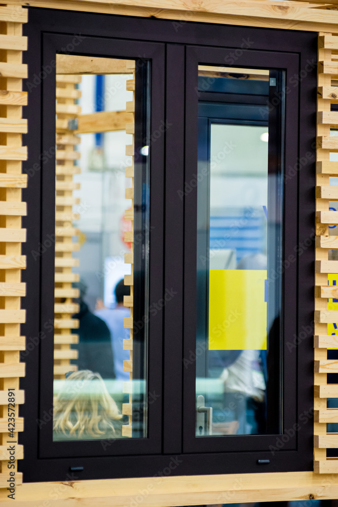 Metal-plastic window in the frame of a wooden house Stock Photo | Adobe ...