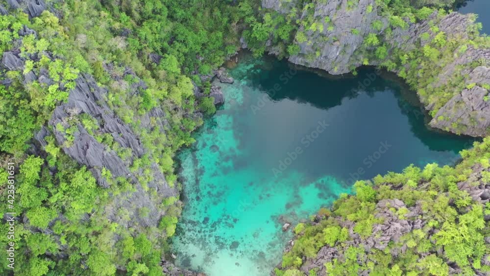 Aerial of limestone karst scenery and turquoise ocean water in Coron ...
