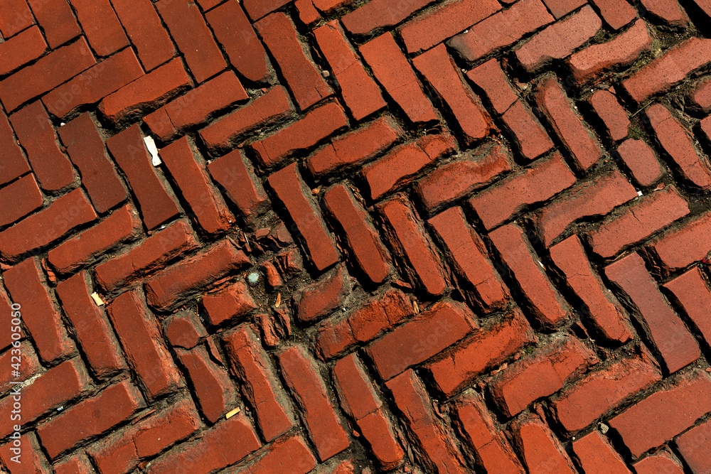 Zdjęcie Stock: Old weathered and broken chipped brick road from ...