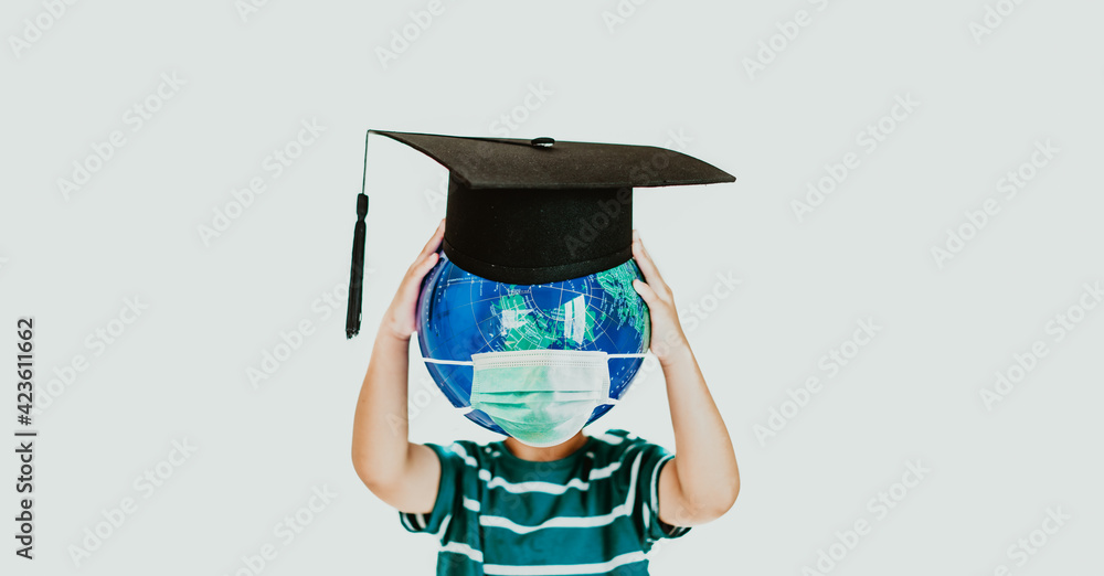 Kid boy student holding globe world with graduate cap mask medical e ...
