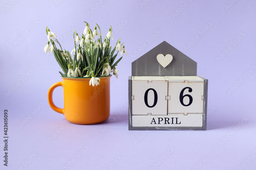 Calendar for April 6: cubes with the numbers 0 and 6, the name of the ...