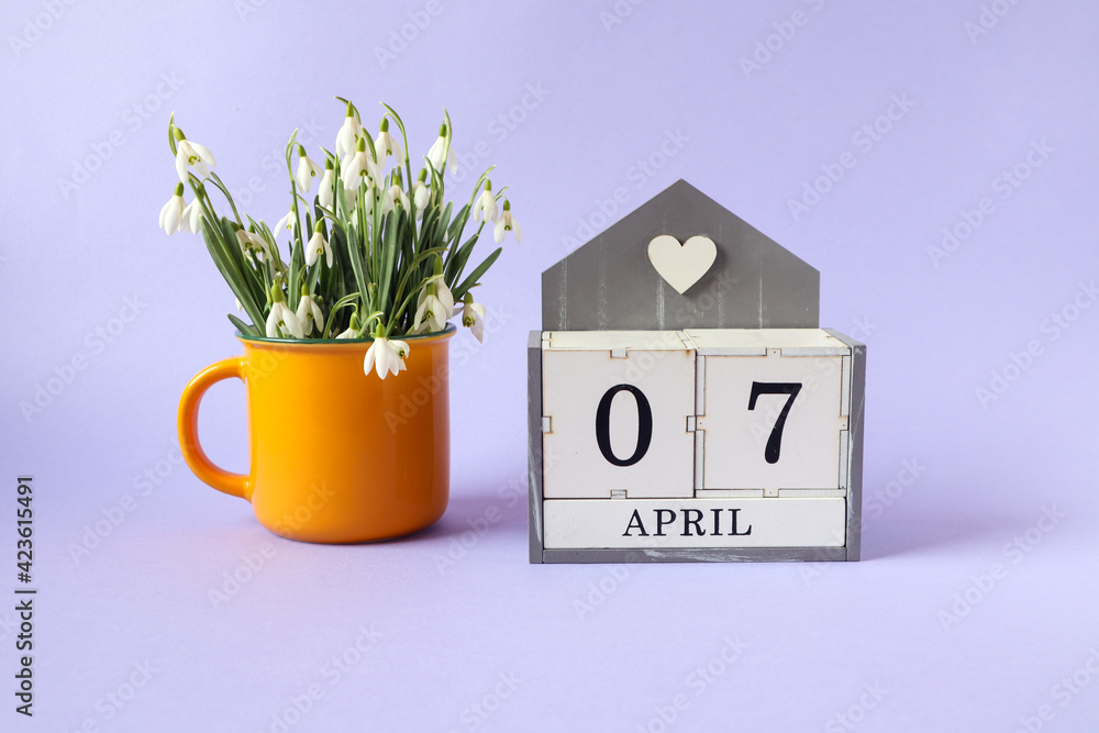 Calendar for April 7: cubes with the numbers 0 and 7, the name of the ...