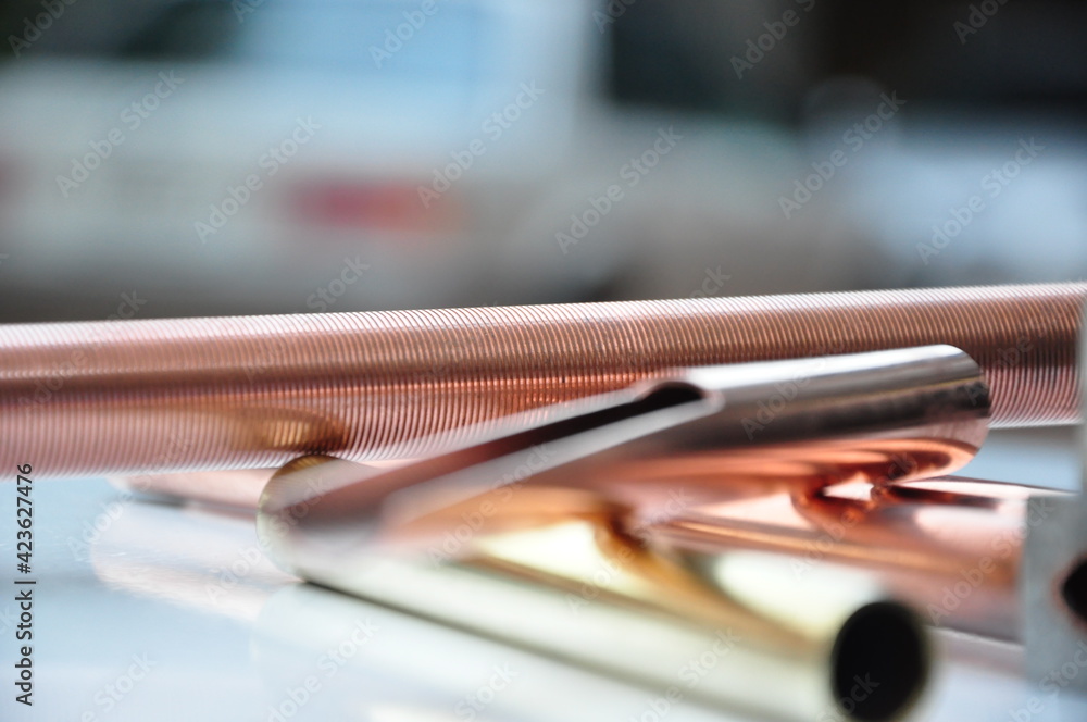 Copper pipe, the pipe is threaded around. Stock Photo | Adobe Stock