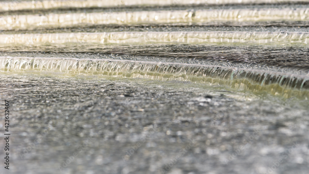Water is cascading over a stepped city water fountain Stock Photo ...