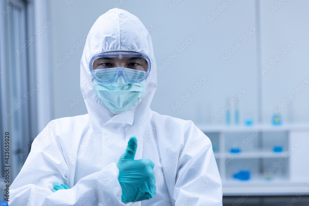 Asian man scientist is wearing Personal Protective Equipment (PPE ...