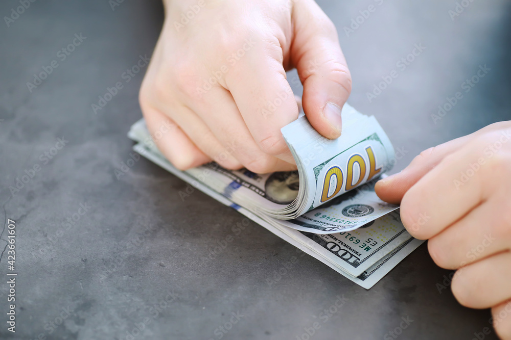 Group of money stack of 100 US dollars banknotes a lot of the ...