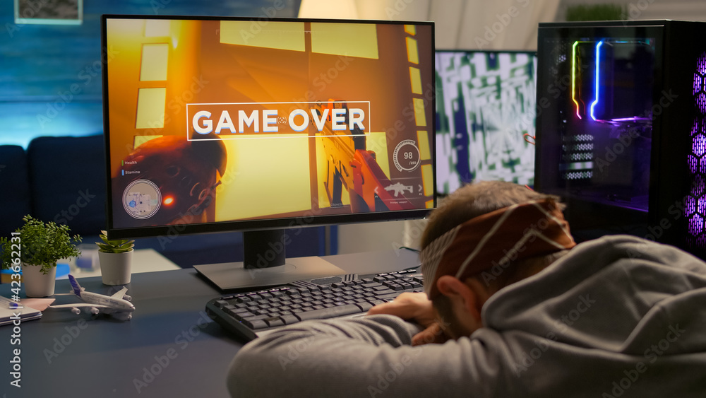 Digital gamer keeping his head on the office after losing first person ...