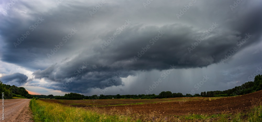 Supercell storm clouds with wall cloud and intense rain Stock Photo ...