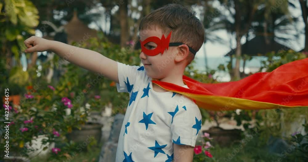 Cute Baby boy in a superhero costume, dressed in a Red cloak and a hero ...