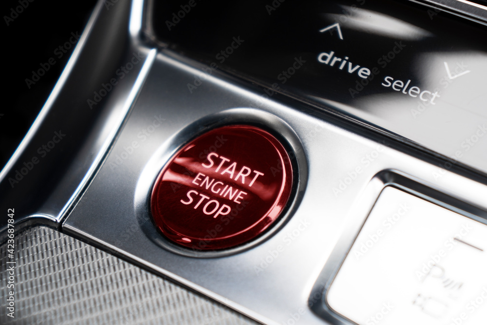 Car dashboard with focus on engine start stop button. Modern car ...