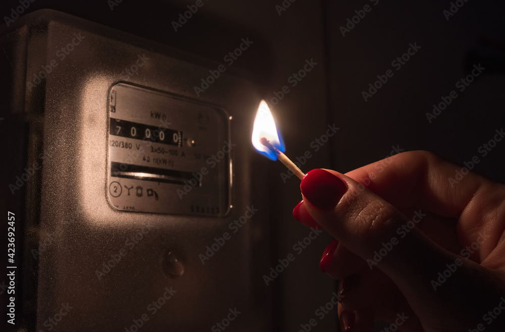 Blackout or power outage, concept image. Woman's hand in complete ...