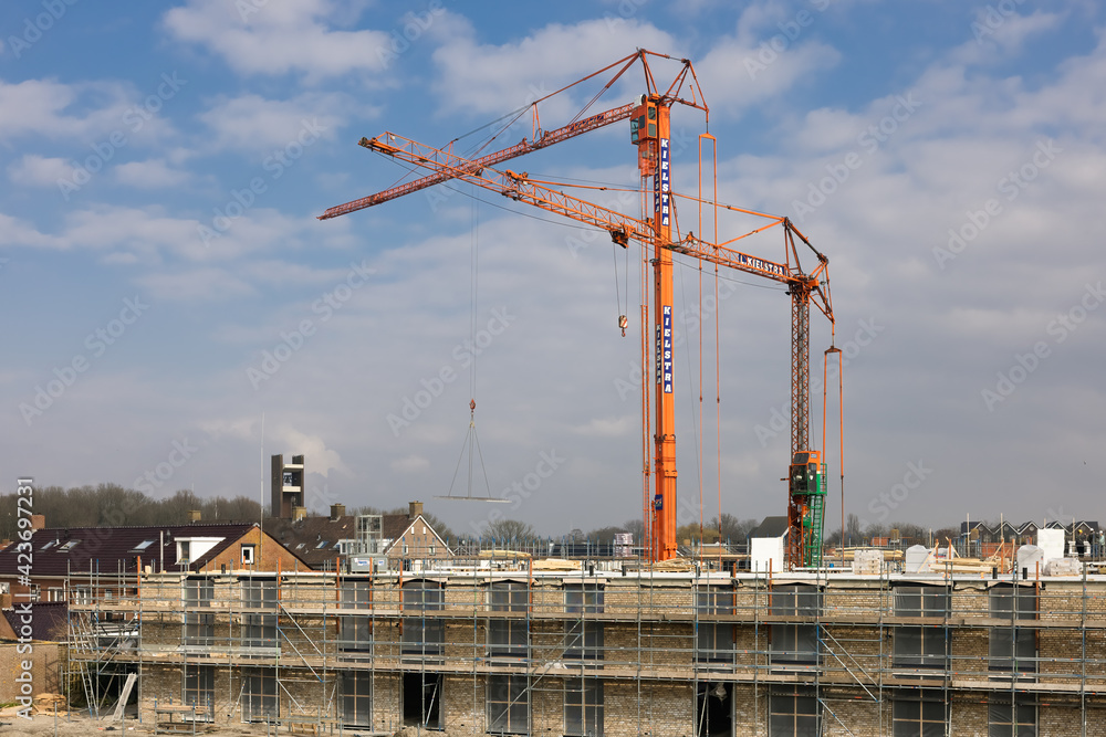 Mobile tower cranes at construction site apartment building Dutch ...
