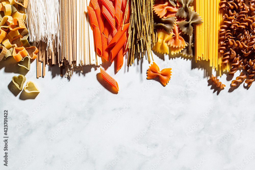 Different types of pasta background. Raw noodles and spaghetti from ...