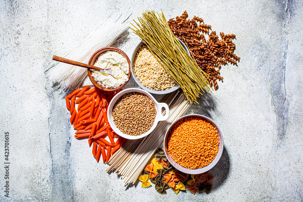 Different types of pasta background. Raw noodles and spaghetti from ...