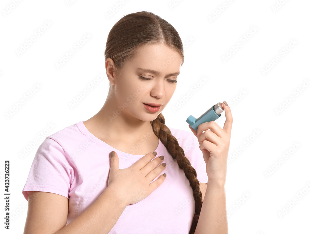Young woman with inhaler having asthma attack on white background Stock ...