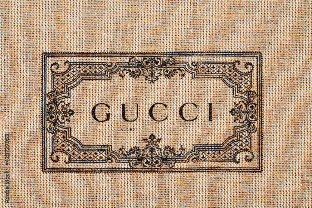 Print impression with the GUCCI logo in black on a linen textile fabric ...